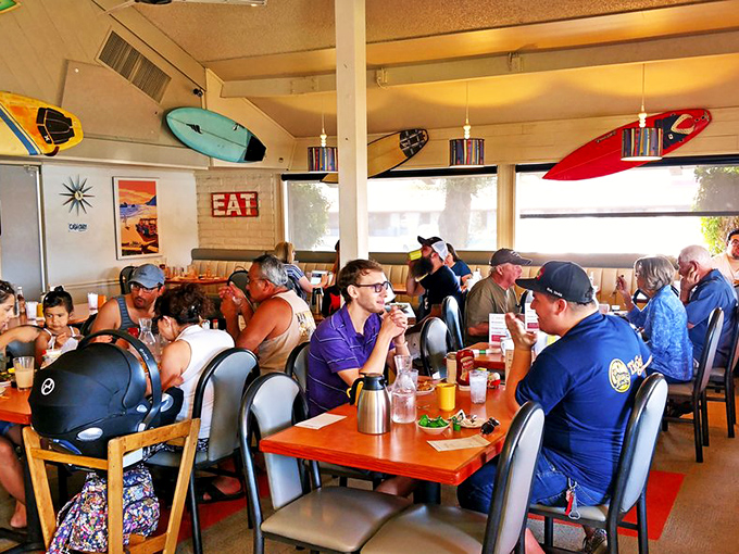 Happy diners, tropical signs, and good times. It's like a Jimmy Buffett song come to life, but with better food.