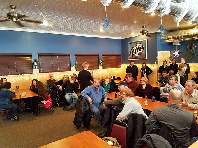 Where everybody knows your name... or at least your chicken order. The Brass Rail's dining room buzzes with community spirit.