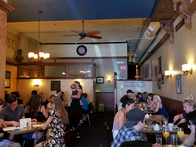 Happy diners, unite! This bustling scene is what happens when good food meets great company. Can you feel the joy?