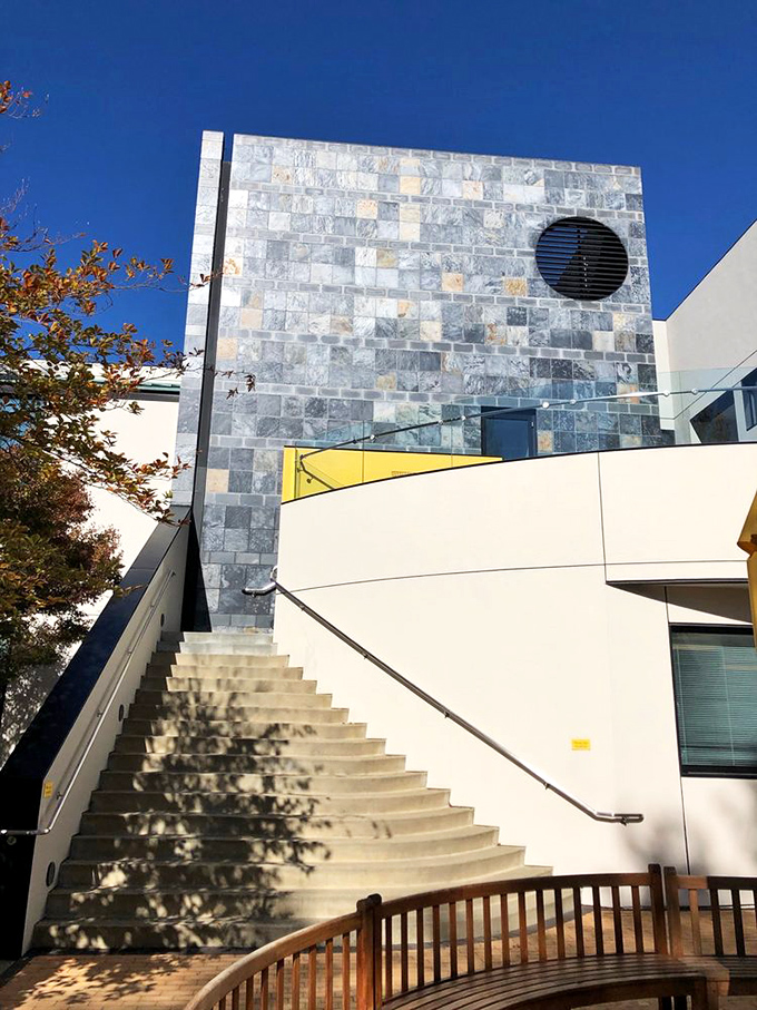 Architectural eye candy! This sleek structure houses a world of wonder. It's like Snoopy's doghouse got a seriously stylish upgrade.
