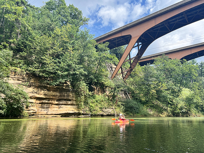 Kayaking under skyscrapers of stone: Where urban explorers trade concrete jungles for nature's own architectural marvels. No hard hat required.