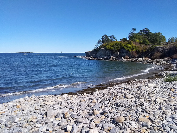 Who needs a sandy beach when you've got a rock concert? Nature's own pebble symphony plays at the foot of history's stage.