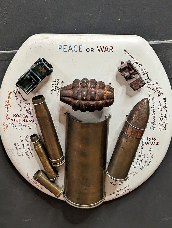 War and peace, toilet seat style. This powerful piece proves that even the most humble canvas can carry a weighty message.