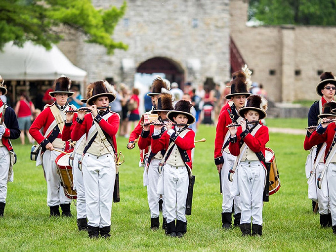 "Attention! These reenactors are so on point, I'm worried they might try to collect taxes for King Louis XV. Don't tread on me, guys!"