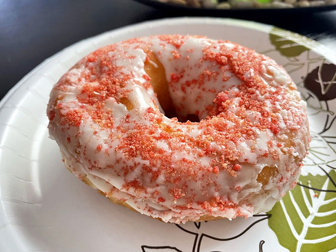 Pretty in pink and sweet all over. This strawberry donut looks like it could star in its own Pixar movie.