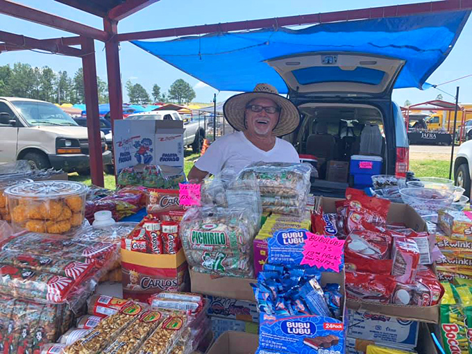 Snack attack central! This jolly vendor's spread of treats could put a dentist's kids through college and your taste buds in heaven.