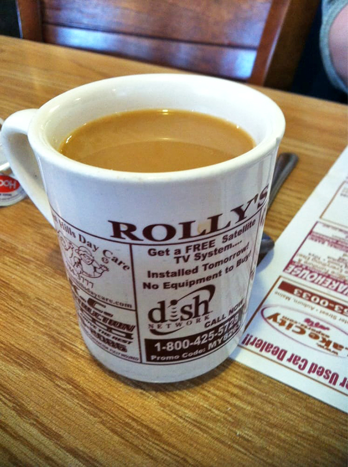 The elixir of life, served in a mug that's part coffee, part local billboard. At Rolly's, even your caffeine comes with a side of community spirit!