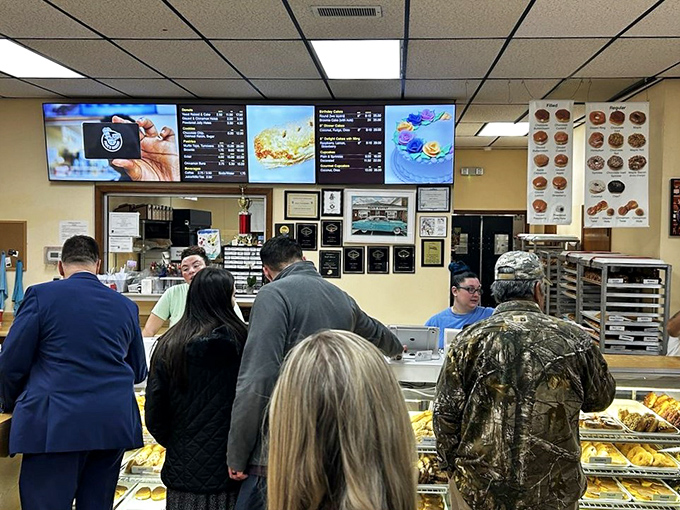 The happiest line you'll ever stand in! These folks know that good things come to those who wait... for donuts.