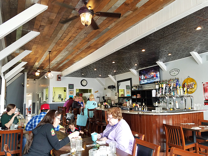 A slice of Americana with a side of laughter: Estelle's dining room buzzes with the happy hum of folks enjoying good food and even better company.