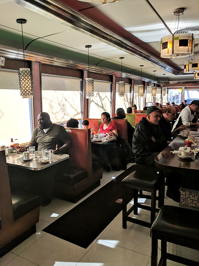 A slice of New York life, served up hot and fresh. These diners aren't just eating; they're participating in a time-honored ritual.