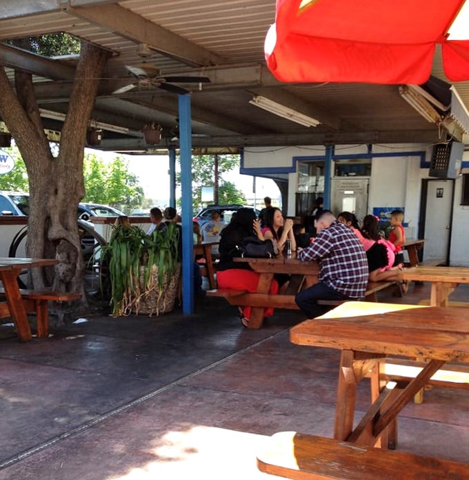 Where strangers become friends over fries, and diet plans go to die. This isn't just eating out; it's a community potluck with better seating.