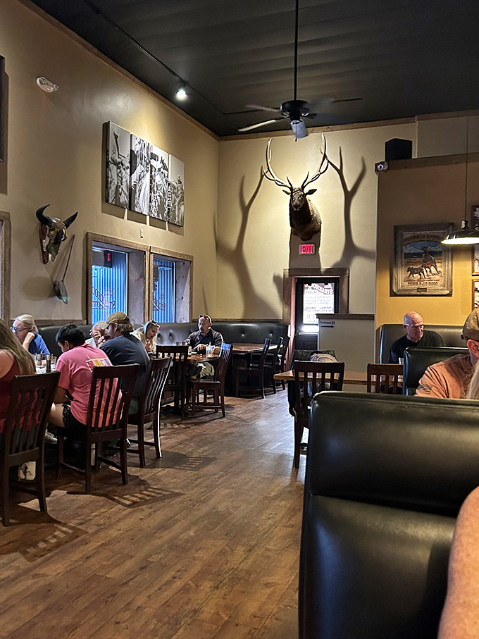 Where everybody knows your steak! This lively dining room scene could be a modern-day "Cheers" &ndash; if Norm ordered ribeye instead of beer.