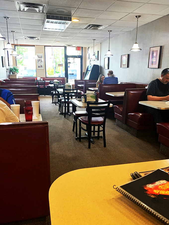 Chili enthusiasts in their natural habitat. These diners know the secret to happiness is a steaming plate of Cincinnati's finest.