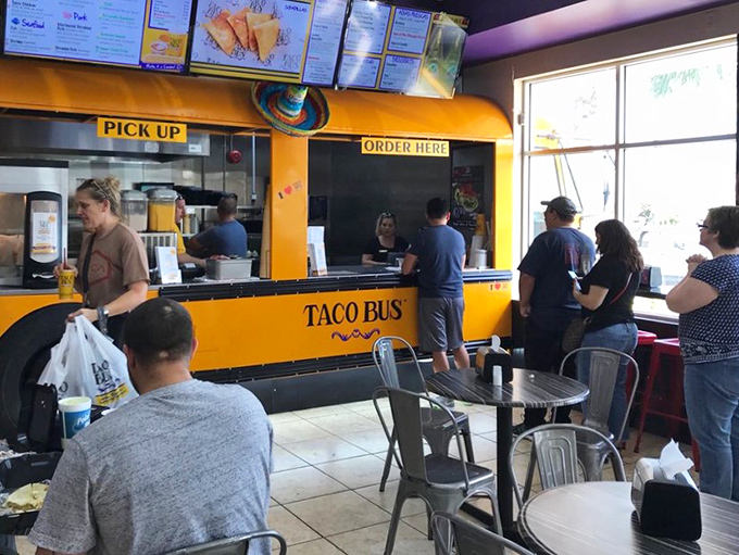 Lunchtime rush or dinner dash? These happy diners know that good things come to those who wait (in line at Taco Bus).