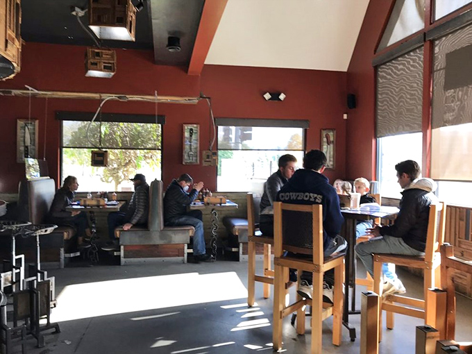Where strangers become friends over brisket. This cozy corner is perfect for swapping BBQ stories and debating the merits of different wood chips.