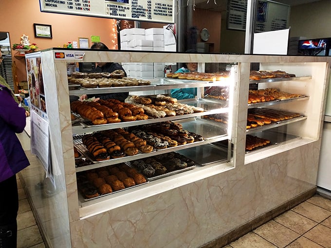 Feast your eyes on this sugary smorgasbord! It's like Willy Wonka opened a donut shop, minus the Oompa Loompas.