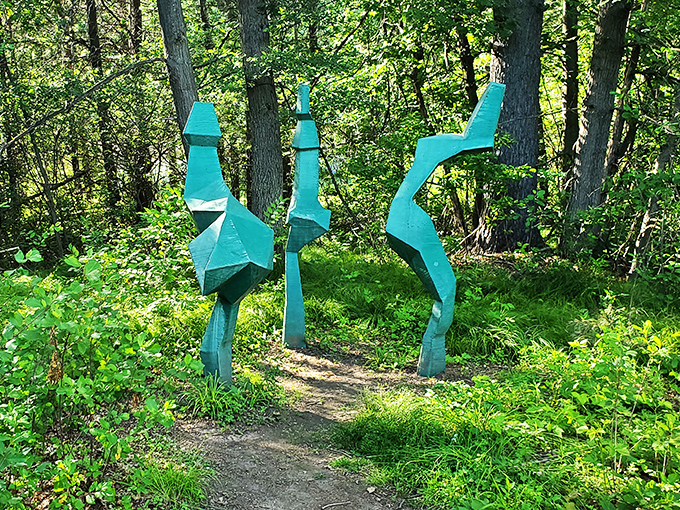 Who says you can't dance in the forest? These teal figures look ready to break into a funky, avant-garde ballet at any moment.