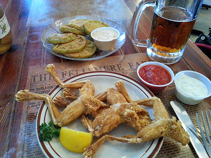 Frog legs and sides: A plate that's hopping with flavor! It's like a Southern potluck where the star dish used to say "ribbit."