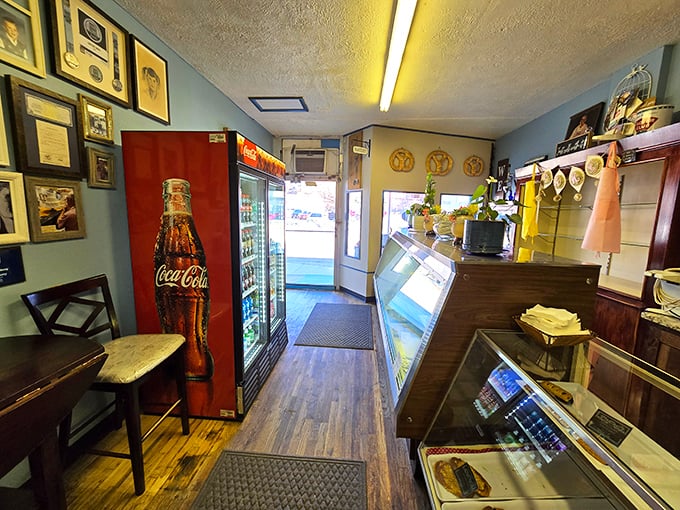 Where retro meets delicious! This interior is like a hug from your grandma, if your grandma was really into Coca-Cola memorabilia and baked goods.