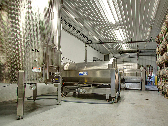 Behind the scenes of sip-worthy magic: Stainless steel giants transform grapes into liquid gold. It's Willy Wonka's for grown-ups!