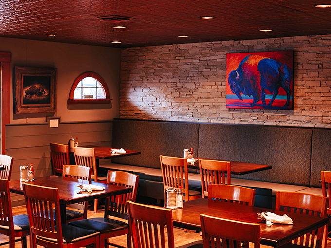 Rustic charm meets modern art in this dining room. It's like eating in a gallery where the masterpiece is on your plate.