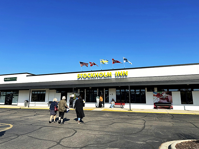 Cheerful yellow sign and welcoming entrance? Stockholm Inn's serving up hygge with a side of heartland hospitality.