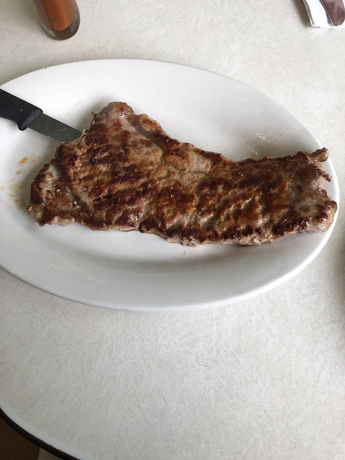 This ribeye isn't just a steak; it's a work of art. Michelangelo had his David, Mickey's has this perfectly seared masterpiece.