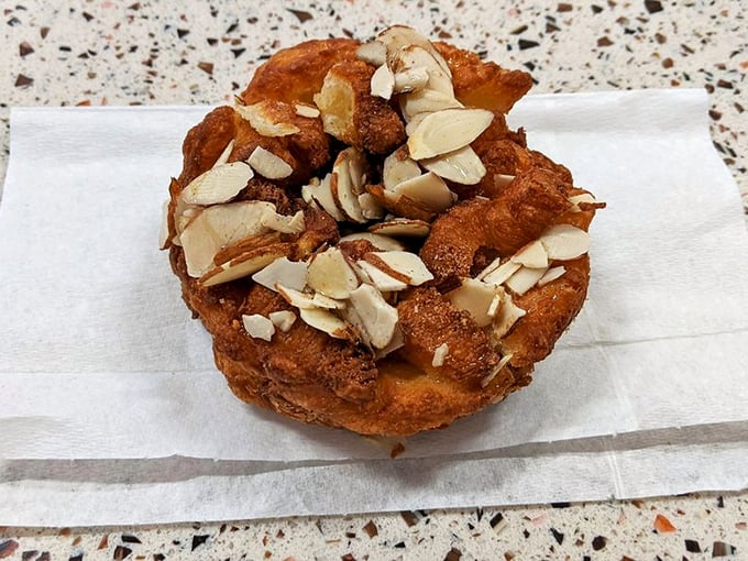Apple and almond join forces in this funnel cake-inspired creation. It's like autumn decided to become a donut!