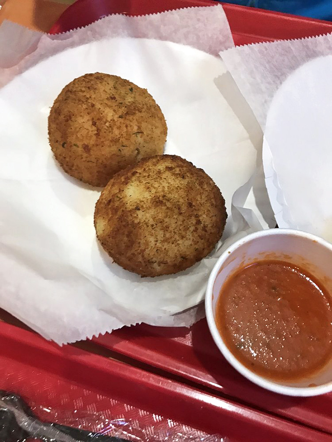 Golden orbs of goodness! These arancini are like the Olympics of appetizers &ndash; they've already won gold in our hearts.
