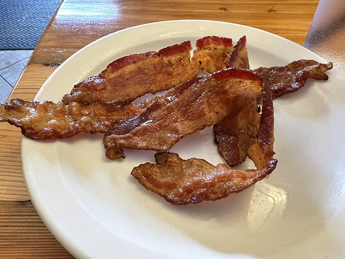 Bacon: nature's candy. These crispy strips are the unsung heroes of any breakfast plate.