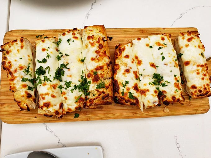 Garlic Cheesy Bread: Because sometimes you need a hug for your mouth. Warning: May cause spontaneous happiness.