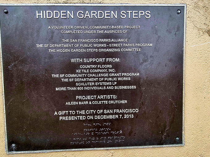 History etched in bronze. This plaque tells the tale of how a community turned a plain old staircase into a work of art.