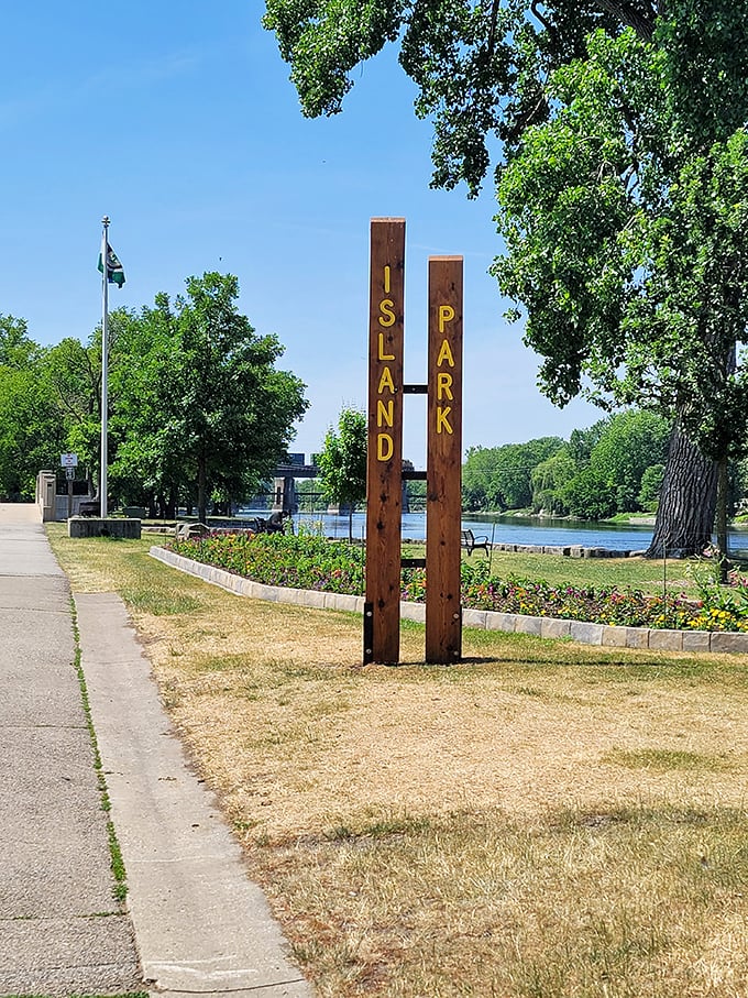 Island Park: Where dreams and reality collide! These wooden posts stand tall, proclaiming the park's name like proud parents.