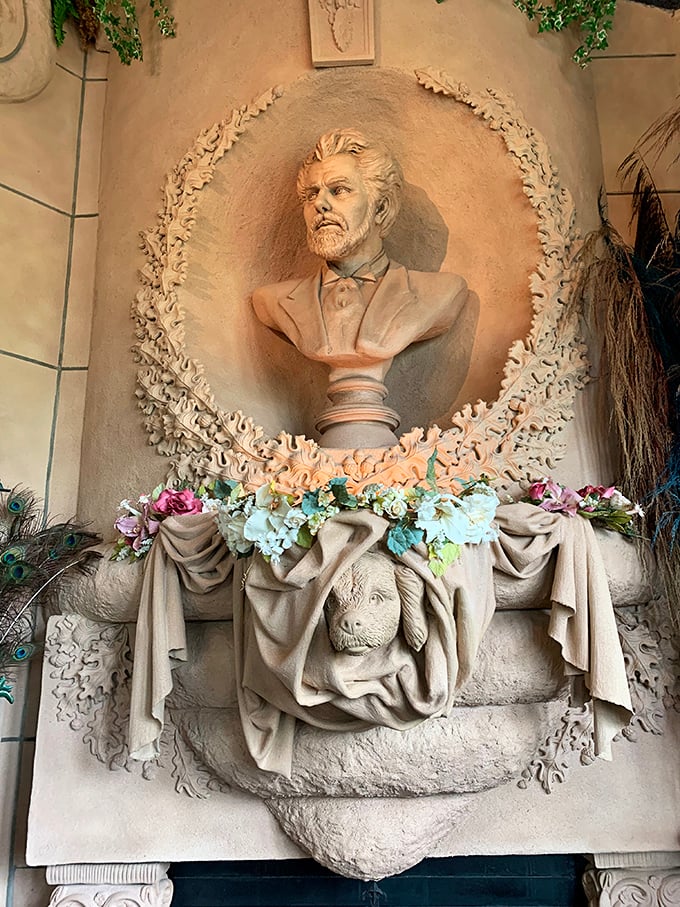 A bust with a view! This dapper gentleman keeps a watchful eye over the castle, surrounded by a floral embrace.