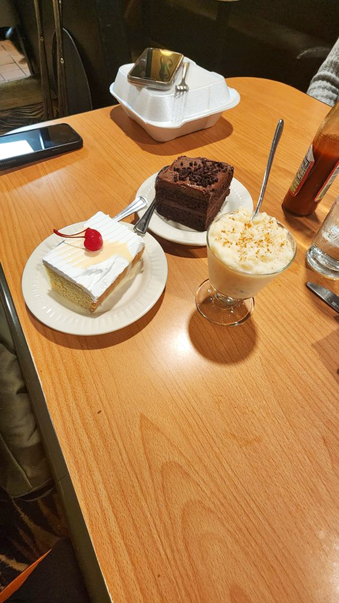 Dessert trifecta! Tres leches, chocolate cake, and something creamy. It's like the Avengers of the dessert world, here to save your sweet tooth.