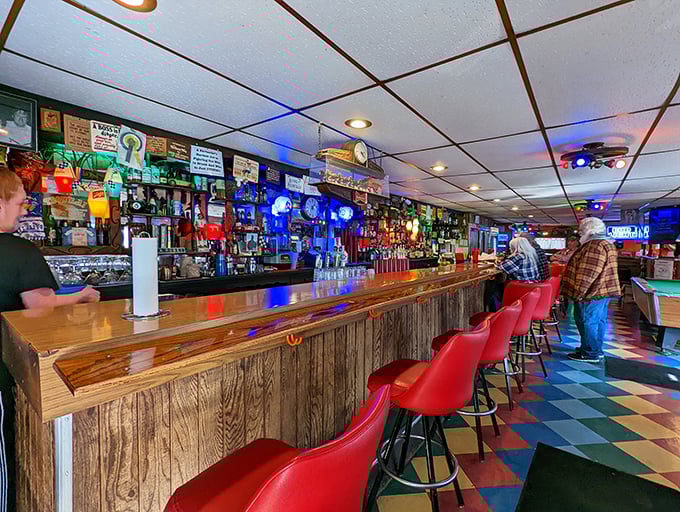 The bar where everybody knows your name... or at least your chicken order. Neon signs and cold beers await!