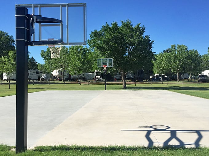 Concrete court, infinite possibilities. Whether you're channeling your inner LeBron or just trying not to trip over your own feet, this basketball area is game-day ready.