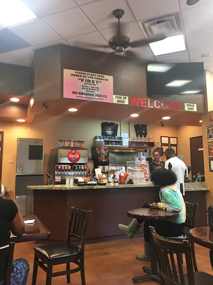 Order up! This bustling counter is where culinary dreams come true. Just remember: patience is a virtue, but hunger is real.
