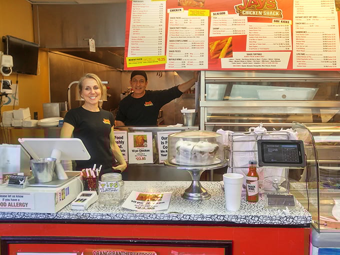 The dream team behind the counter! These folks are the unsung heroes of your taste bud adventures, serving up smiles as warm as their chicken.