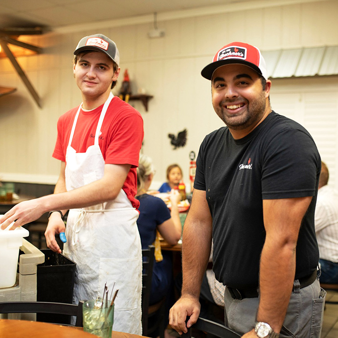 The unsung heroes of flavor town. Buckner's crew keeps the comfort food flowing with smiles as warm as their famous peach cobbler.