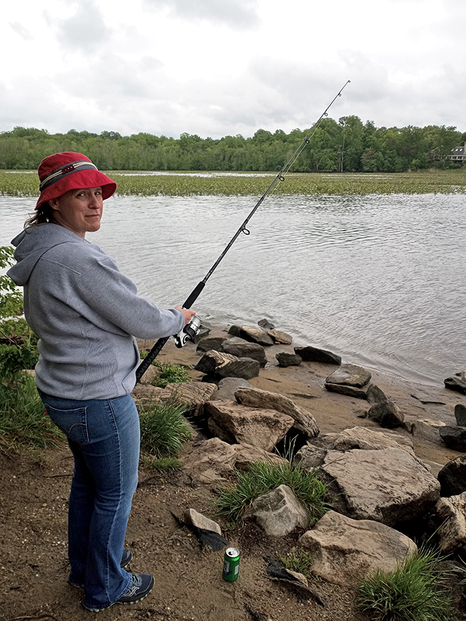 Gone fishin': At Martinak, the early bird gets the... fish? This angler's determined look says it all &ndash; the big one won't get away today!