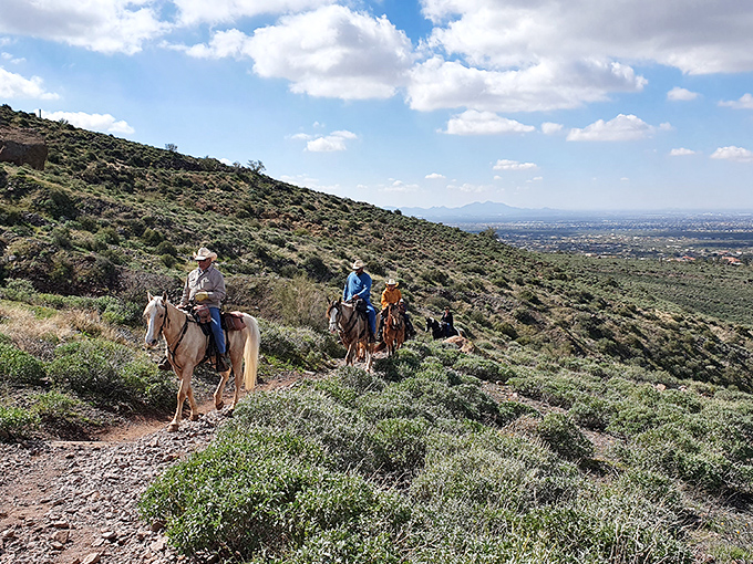 Giddy up, partners! These trail riders are living out their cowboy dreams, with panoramic views as their backdrop. Yeehaw!