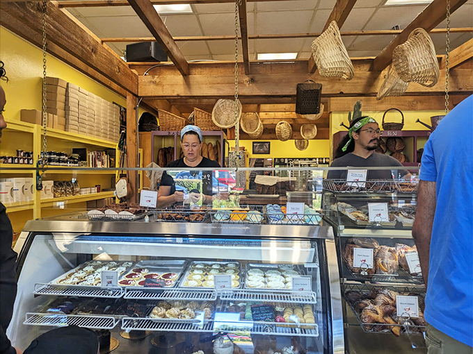 Behind the counter, where the magic happens. These bakers are like the Avengers of the pastry world.