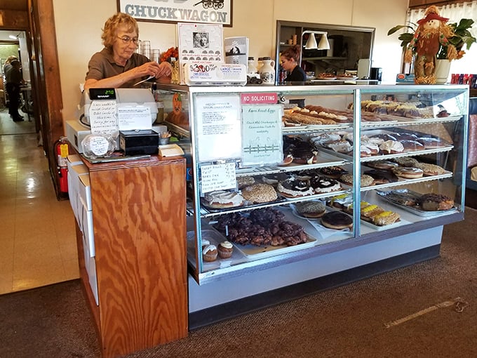 The wizard behind the curtain! This friendly face is the gatekeeper to a world of sweet and savory treasures.