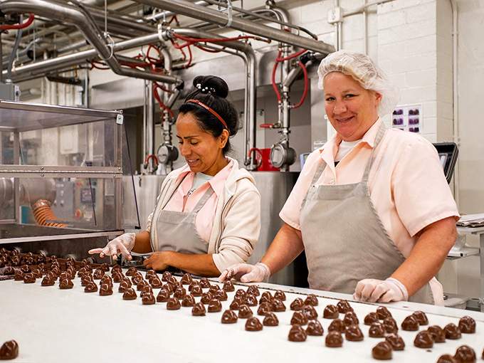 Behind the scenes of sweetness! These chocolate artisans are like the Michelangelos of the confectionery world, crafting edible masterpieces one truffle at a time.