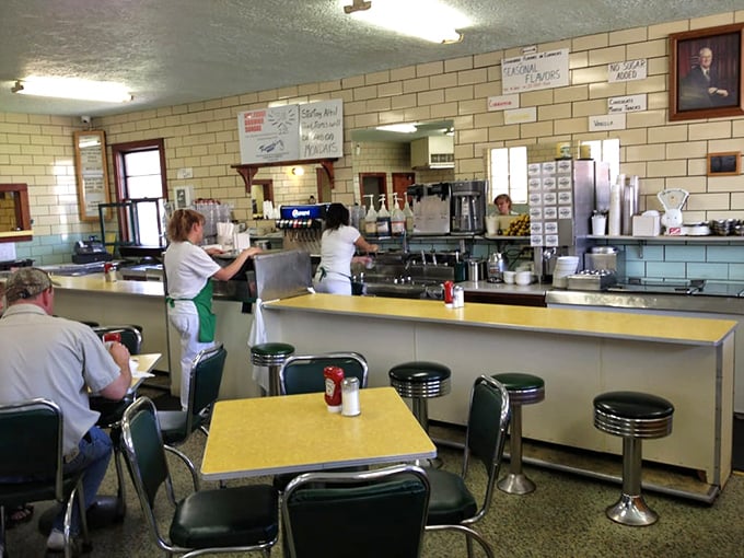 The wizards behind the counter, crafting edible magic. These folks could probably solve world peace with ice cream.