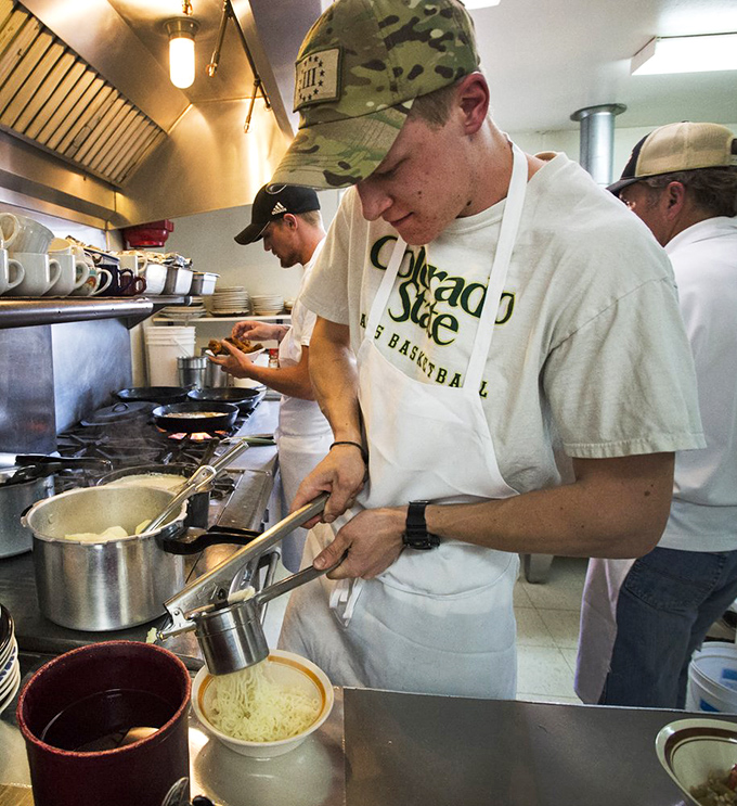 Kitchen wizards at work! These culinary magicians are the secret behind Juniper Valley Ranch's mouthwatering meals.