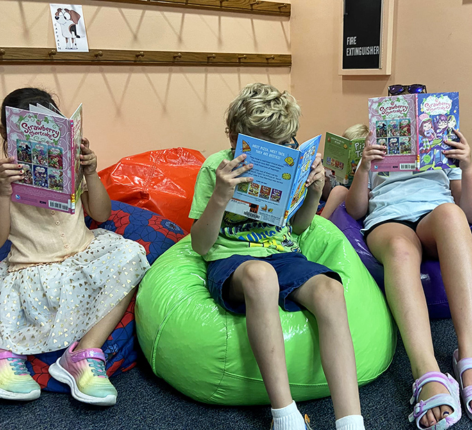 Caught in the act of summer reading! These kids are living proof that not all superheroes wear capes &ndash; some wield books.