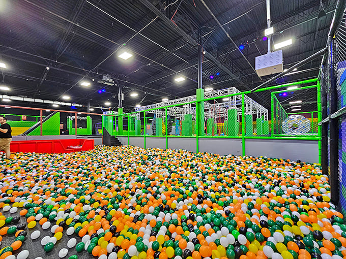 Dive into a sea of colorful orbs! It's like swimming in a giant bowl of Fruit Loops, minus the sticky milk.