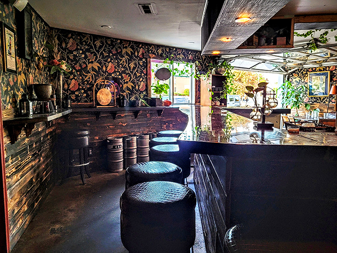 This bar isn't just serving drinks, it's serving atmosphere. Floral wallpaper meets mixology in a delightful visual cocktail.